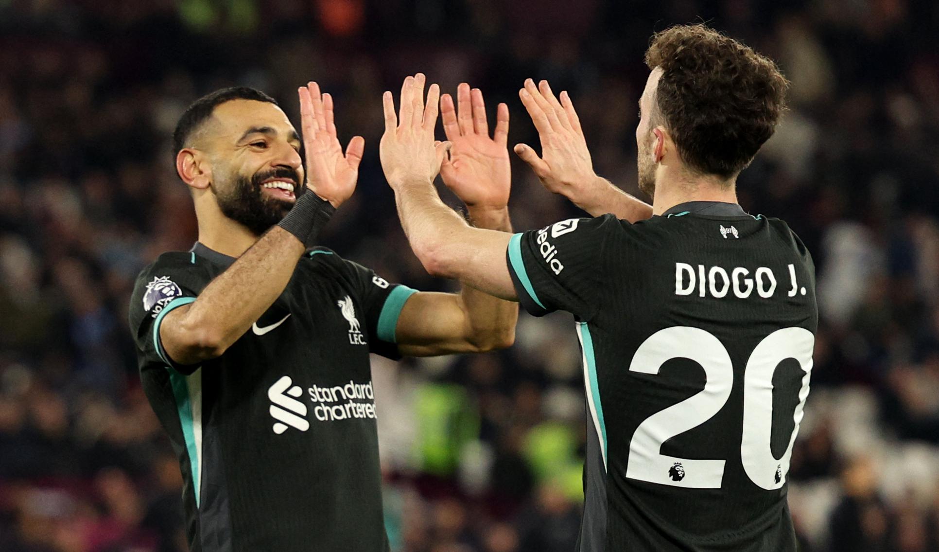 Salah sets more records as Liverpool move eight points clear